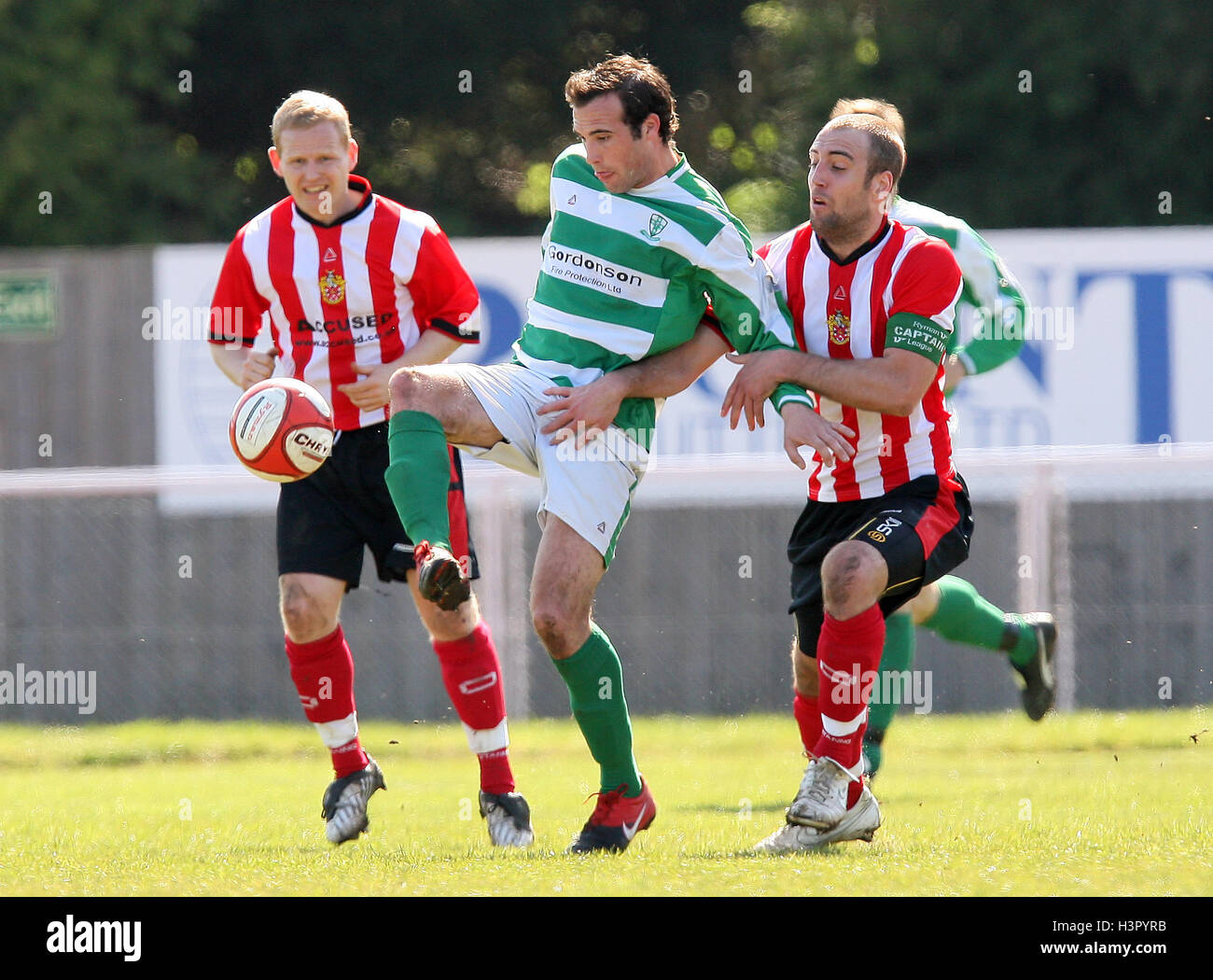 Mark Sontag of Waltham Abbey seeks to evade Elliot Styles (R) and Andy ...