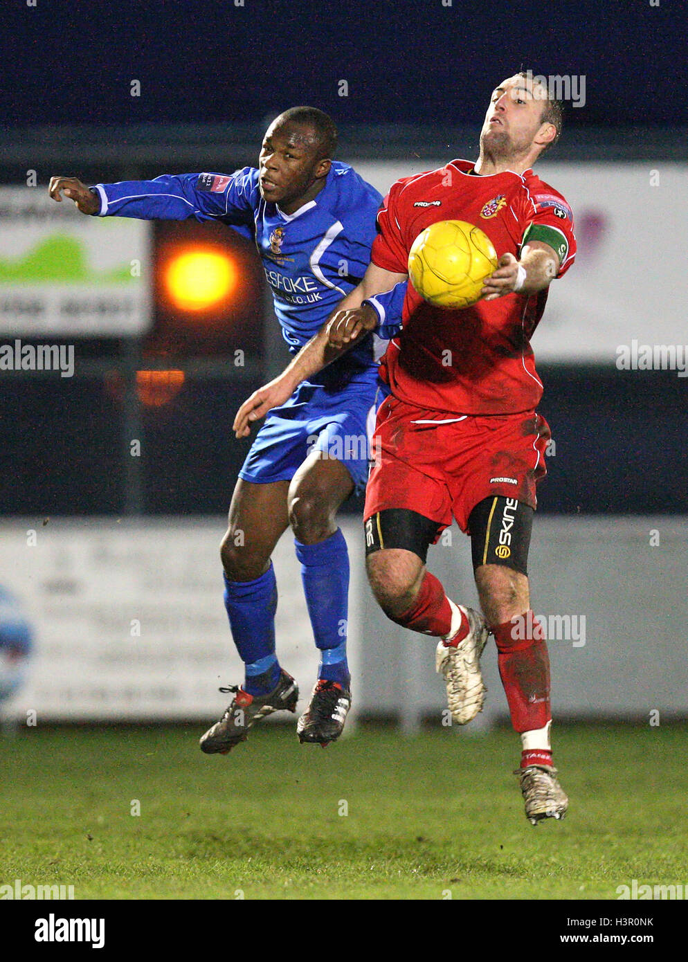 Ryan Edgar of Aveley jumps with Elliot Styles of Hornchurch - Aveley vs ...