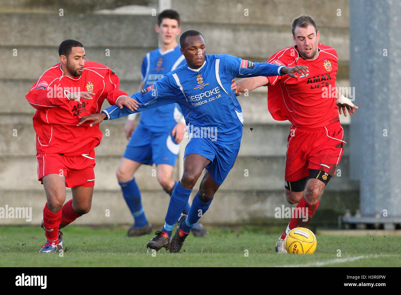 Ryan Edgar of Aveley is sandwiched by Elliot Styles (R) and Michael ...