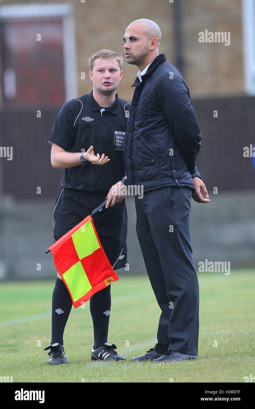 Aveley manager Justin Gardner speaks to the referee's assistant before ...