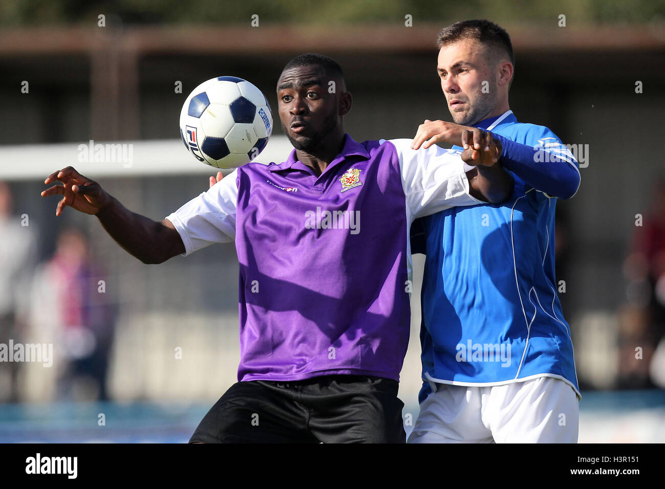 Tambeson Eyong of Hornchurch shields the ball from Joe Anderson of ...