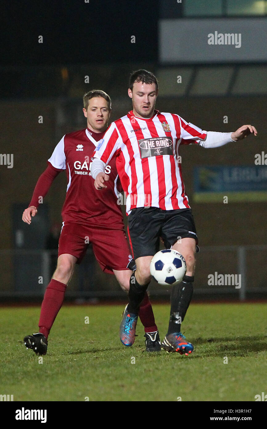 Martin Tuohy of Hornchurch shields the ball from Justin Miller of ...