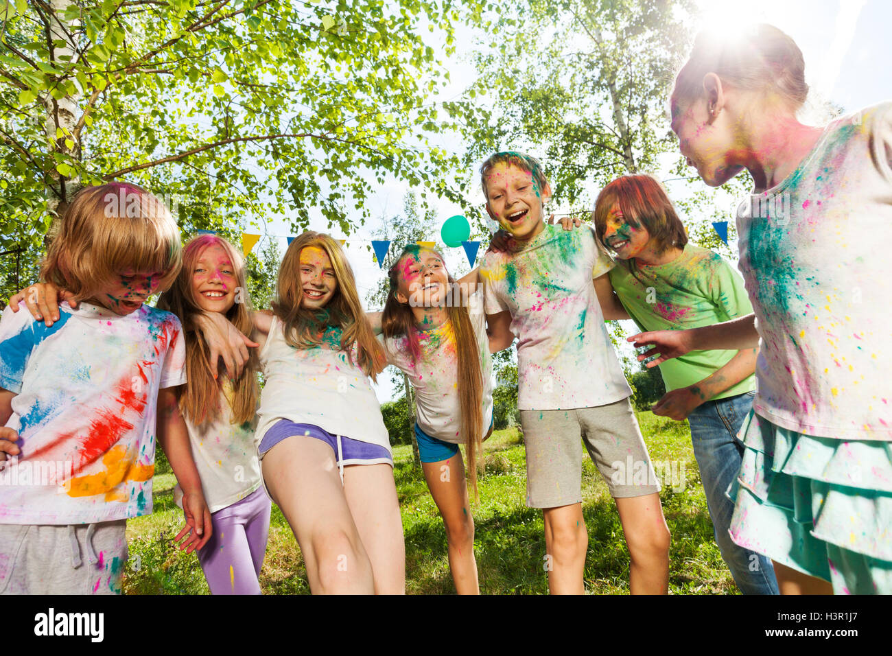 Kids colored with color powder dancing outdoor Stock Photo - Alamy