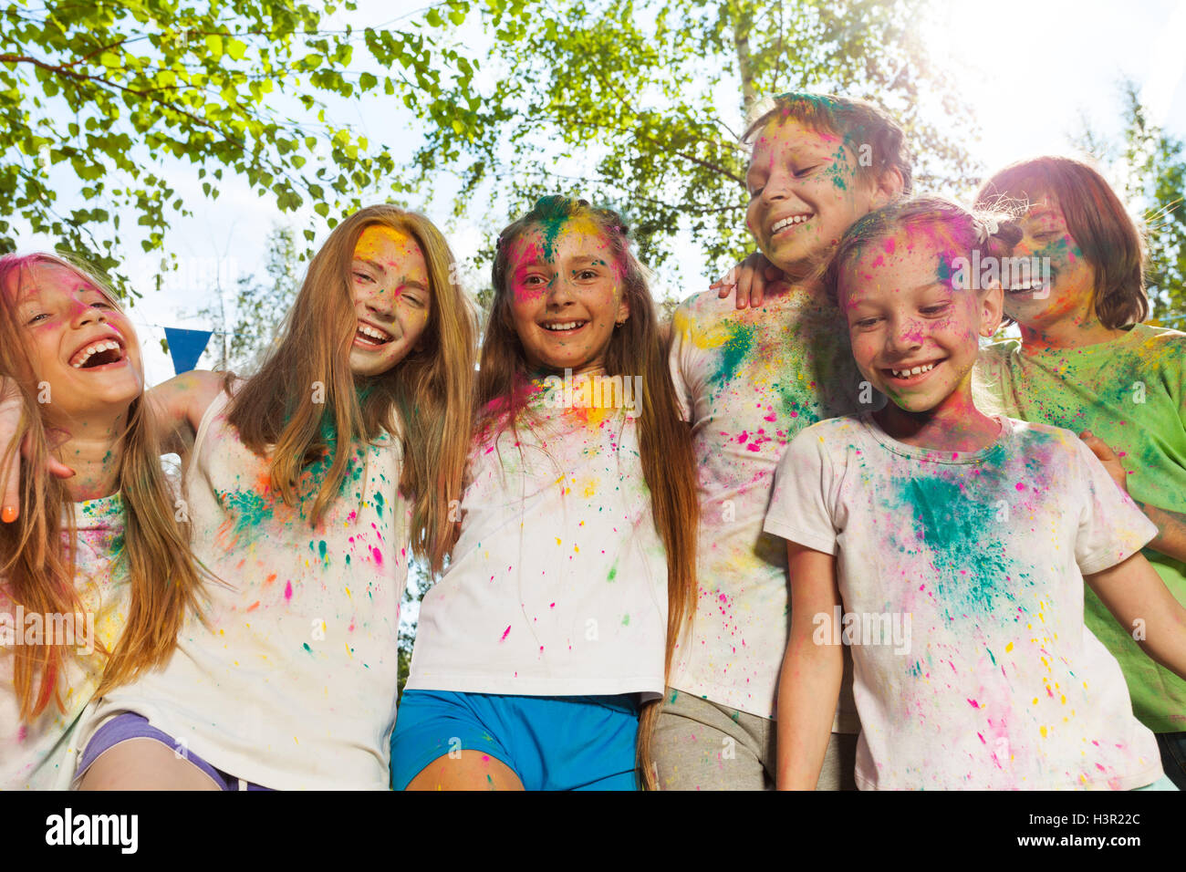 Kids smeared with colored powder on the color fest Stock Photo - Alamy