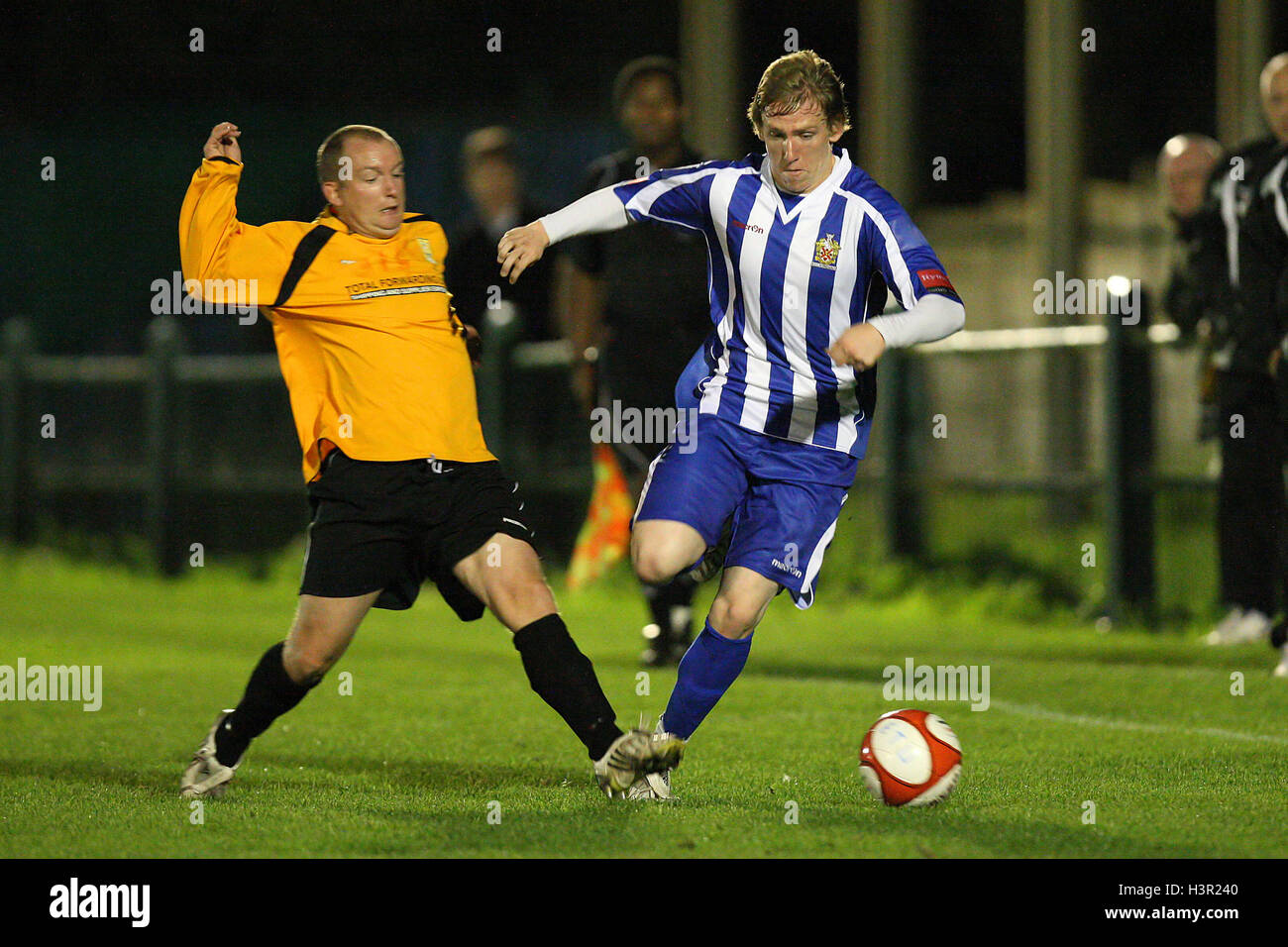 Jordan Collins of AFC Hornchurch is challenged by Joe Keith of East ...