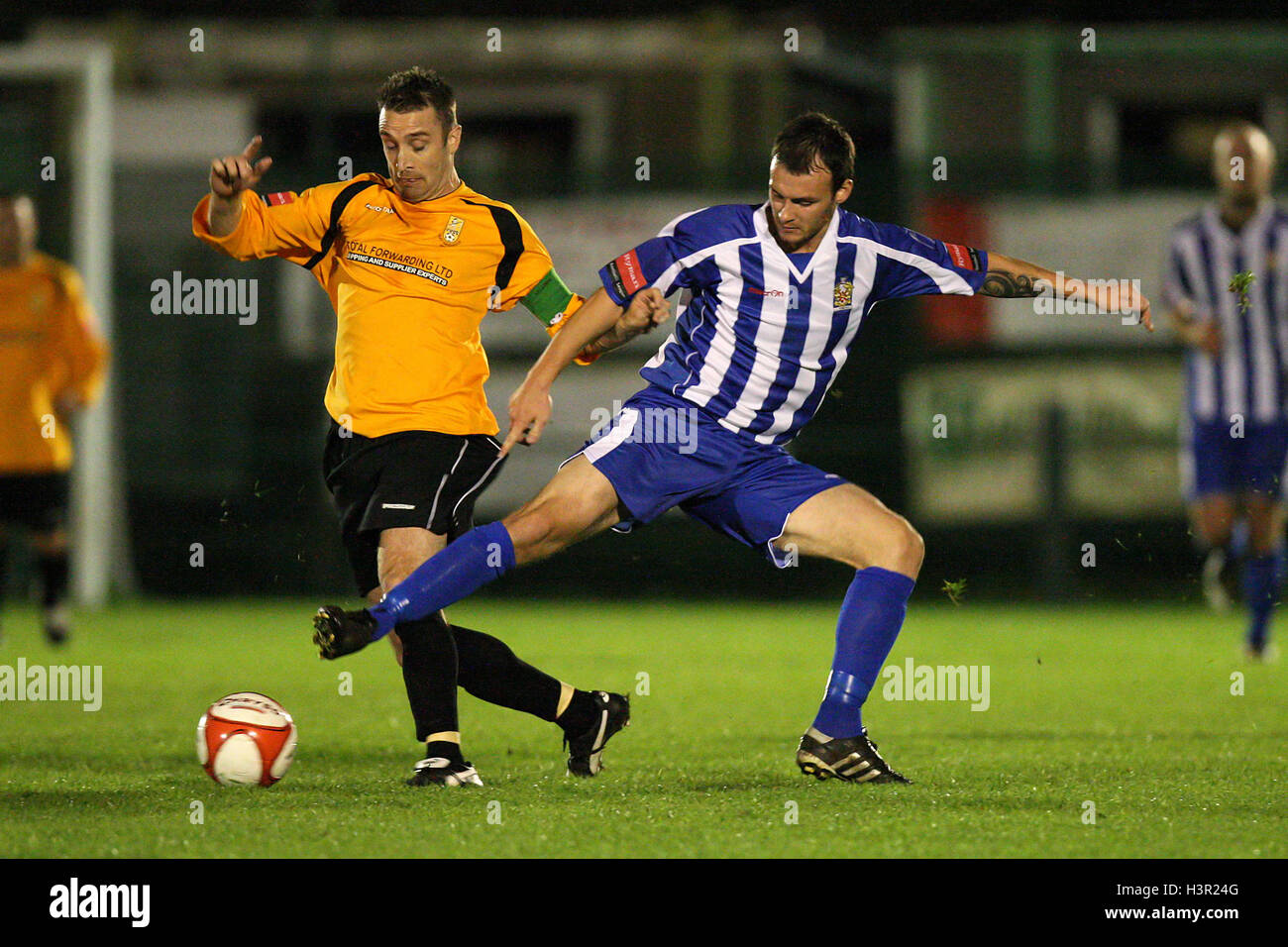 Martin Tuohy of Hornchurch tangles with Steve Harrison of East Thurrock ...