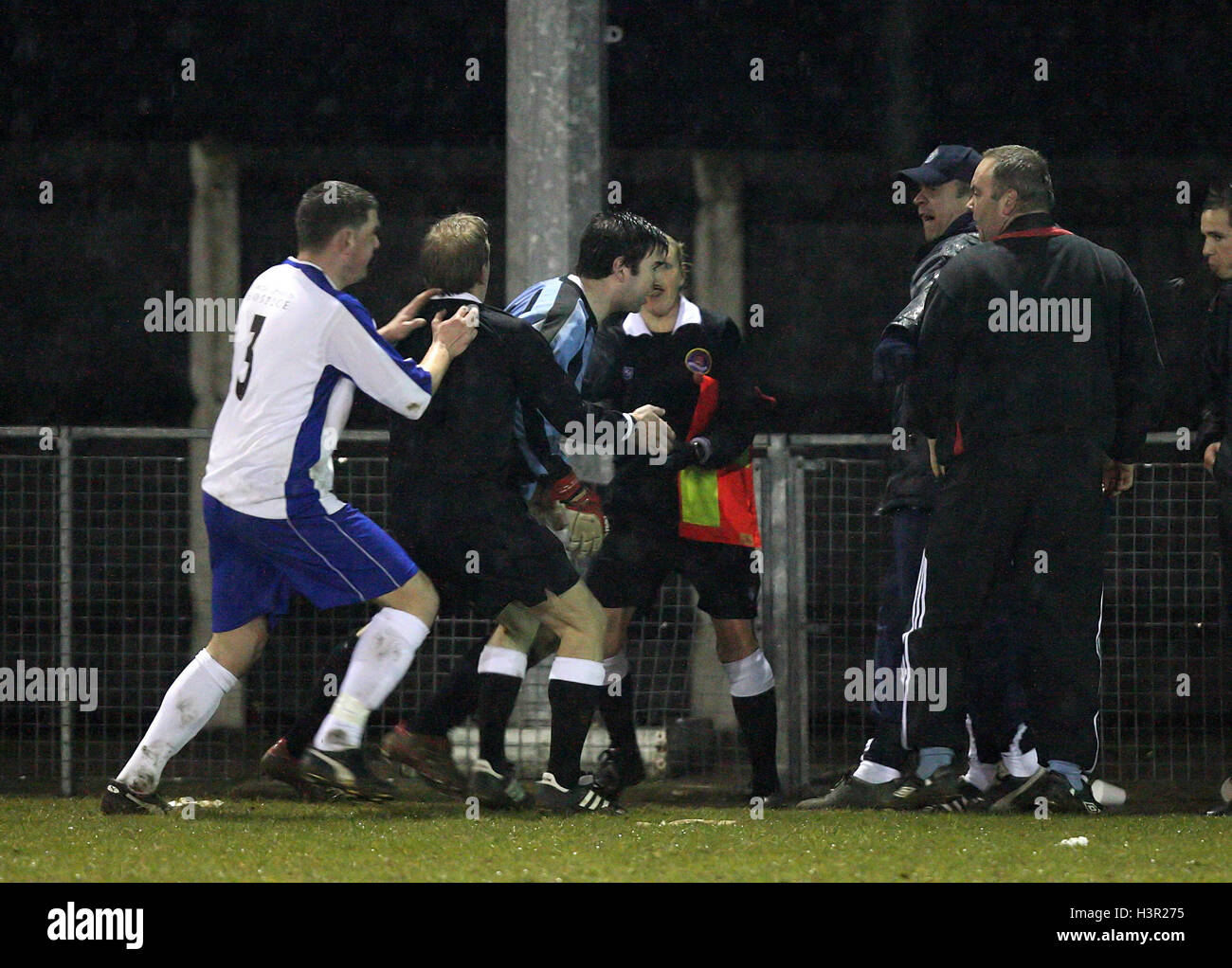 Jerry Lyons makes the score 2-0 to Romford and Enfield players protest ...