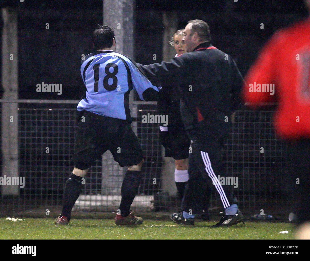 Jerry Lyons makes the score 2-0 to Romford and Enfield players protest ...