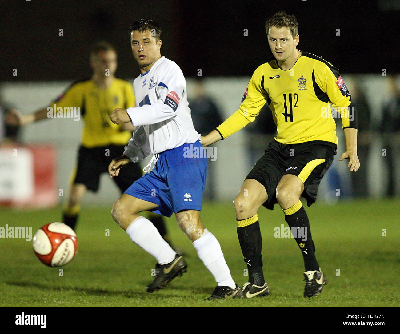 Rudi Hall of Enfield Town shields the ball from Bobby Port of Romford ...