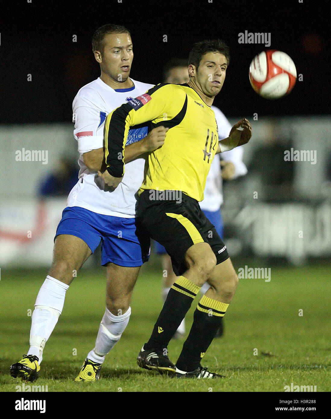 Jimmy Noakes of Romford shields the ball from Dave Blower - Enfield ...
