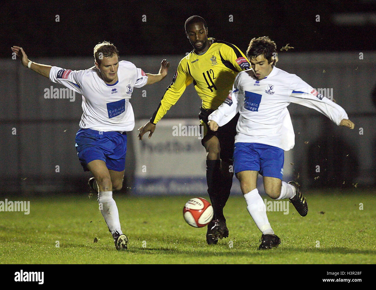 Sean Clarke of Romford is sandwiched by Alex Kirby (L) and Mark Thomson ...