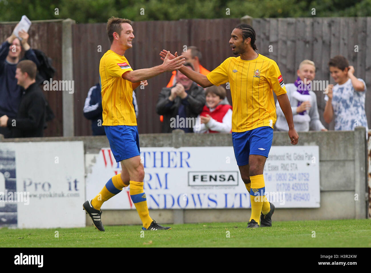 Carl Rook (L) congratulates Stefan Payne of AFC Hornchurch on scoring ...