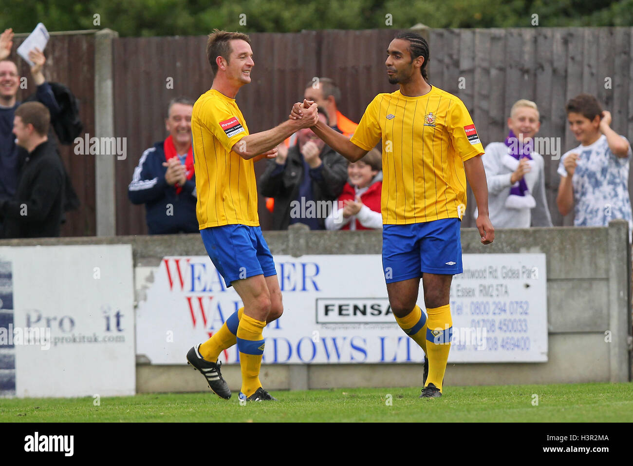 Carl Rook (L) congratulates Stefan Payne of AFC Hornchurch on scoring ...