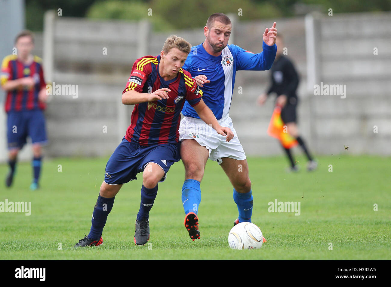 Robbie Norris of Romford battles it out with Ryan Maxwell of Grays ...