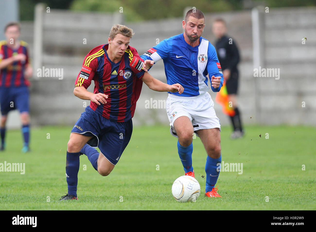 Robbie Norris of Romford battles it out with Ryan Maxwell of Grays ...