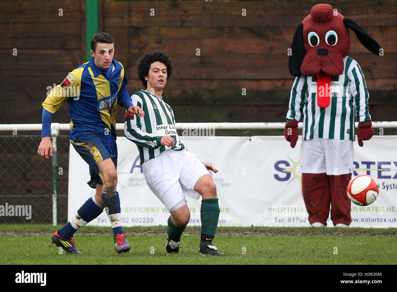 Jake Gibson of Great Wakering clears the ball from Jamie Dicks as the ...