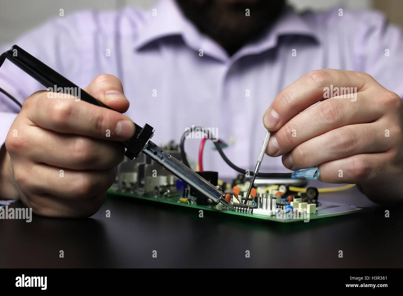 chip soldering by man hands Stock Photo - Alamy