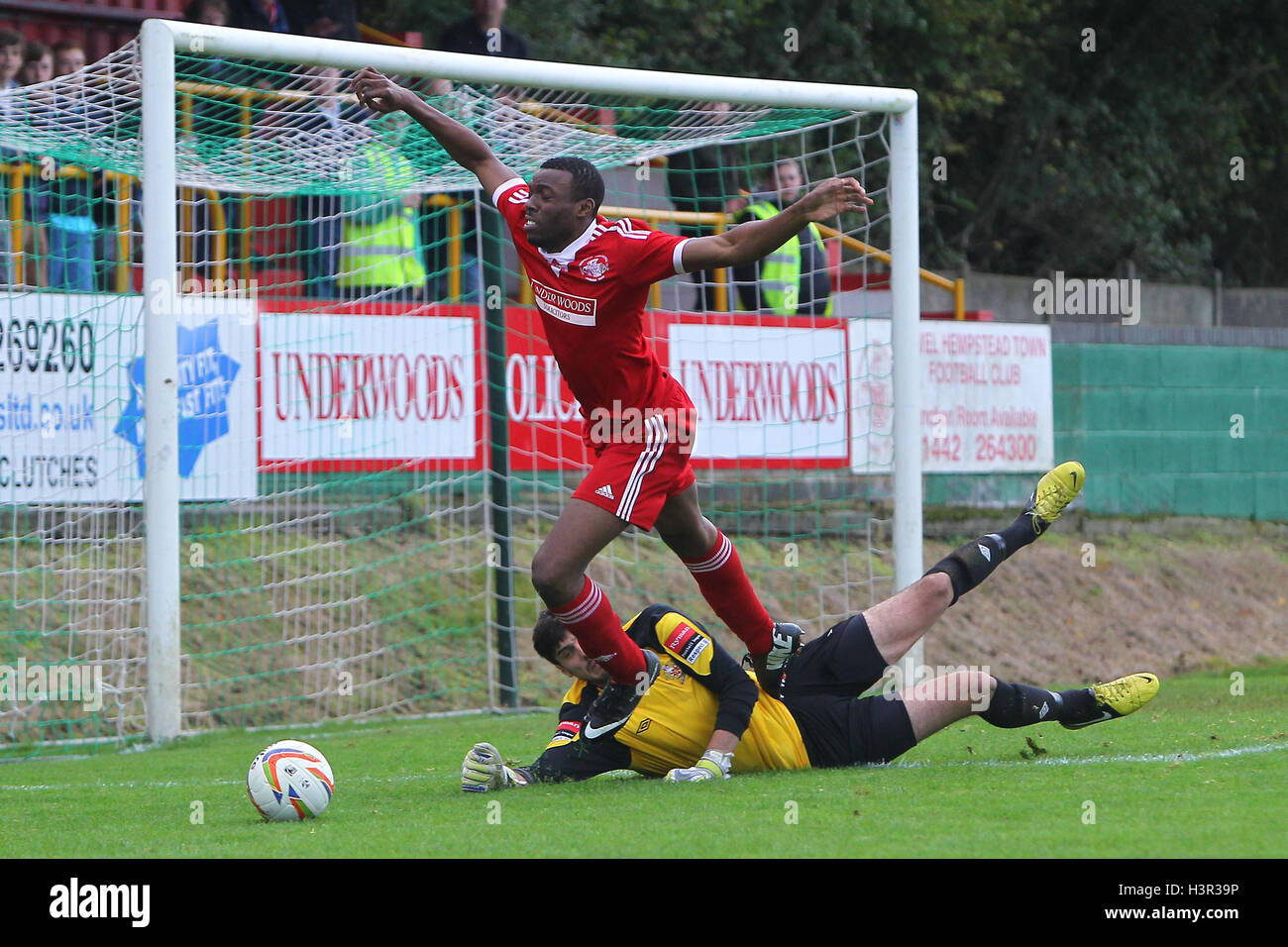 Charlie Mpi of Hemel Hempstead Town tumbles over the challenge of Inigo ...