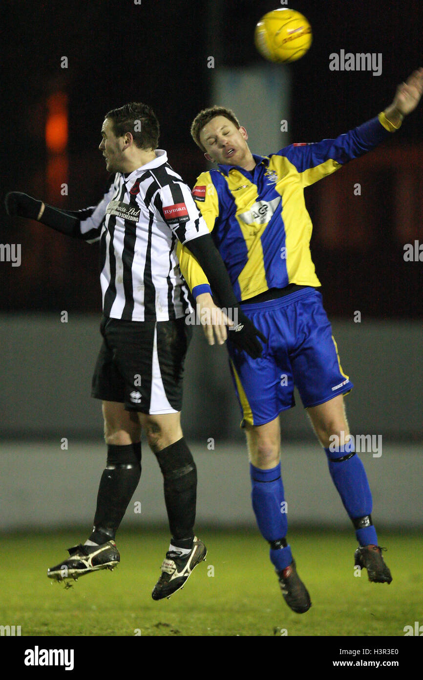 Luke Callander of Heybridge rises with Paul Kavanagh of Romford ...