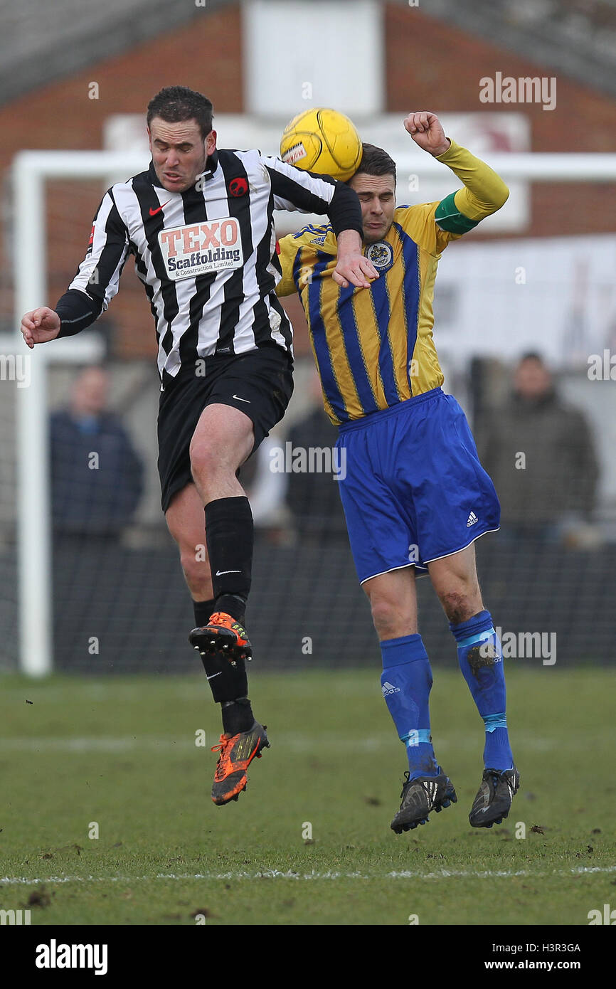 Luke Callander of Heybridge rises with Paul Clayton of Romford ...