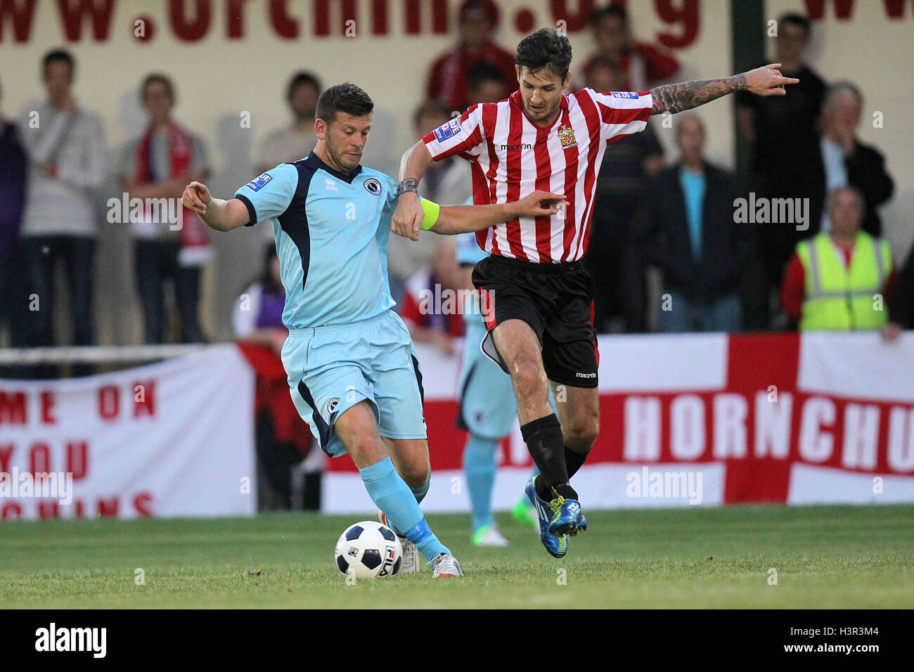 Luke Gerrard of Boreham Wood tangles with Simon Glover - AFC Hornchurch ...