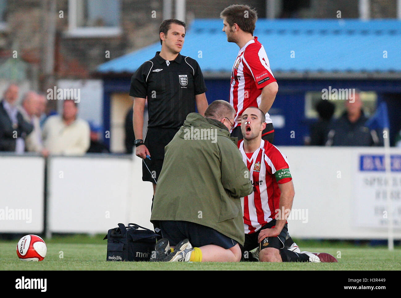 Elliot Styles of Hornchurch is treated for a nose injury - Lowestoft ...