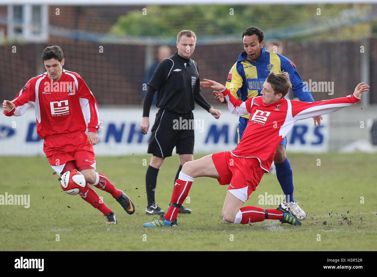 Chris Sullivan of Romford is challenged by Sam Clarke - Romford vs AFC ...