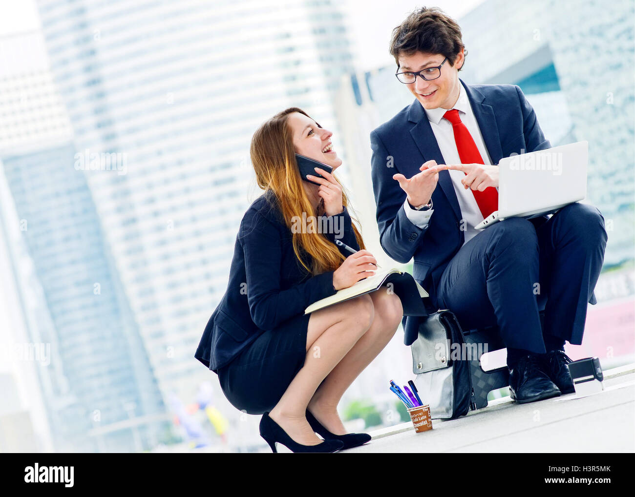 Junior executives dynamics working outside of their office Stock Photo ...