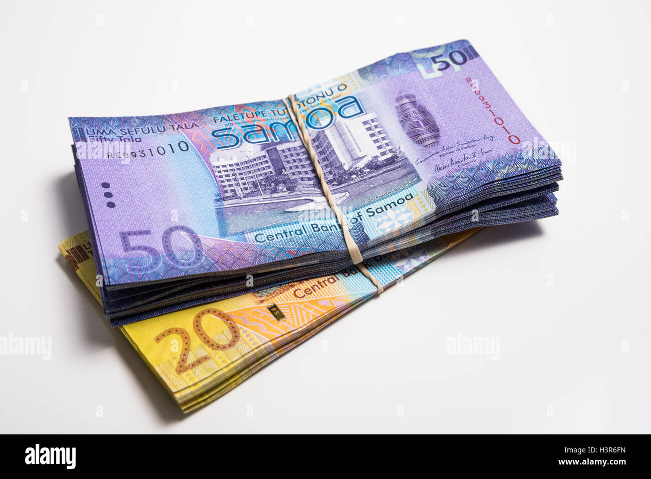 Pile of Samoa Tala bank notes isolated on white Stock Photo - Alamy
