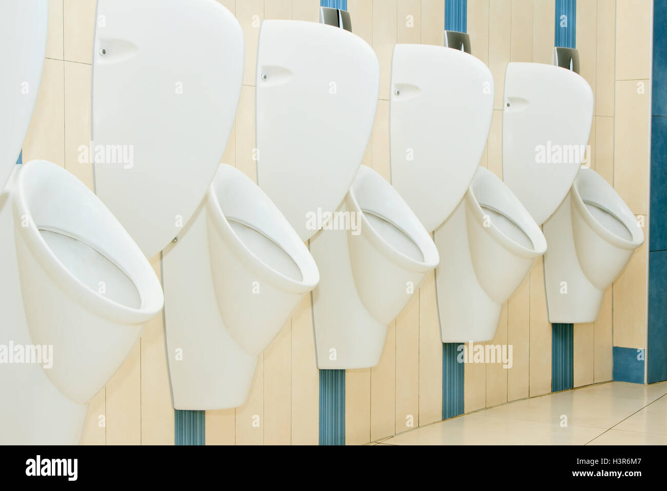 modern restroom interior with urinal row Stock Photo - Alamy