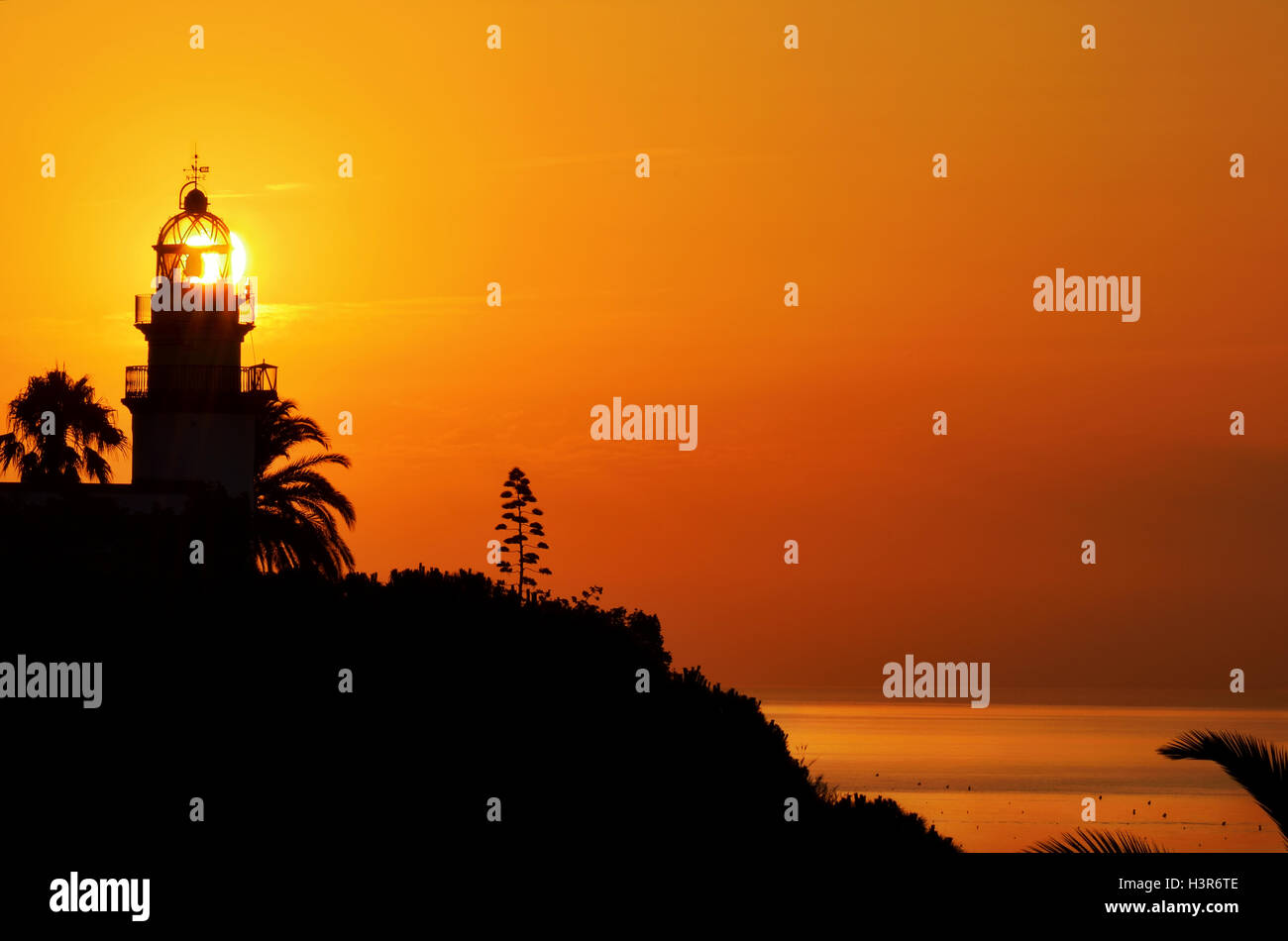 The House of Light - Calella's lighthouse at sunrise Stock Photo - Alamy