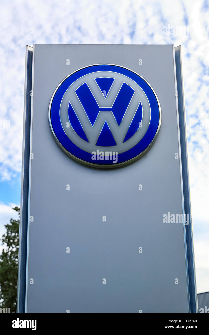 VW Sign outside a VW Showroom with Clouds overhead Stock Photo - Alamy