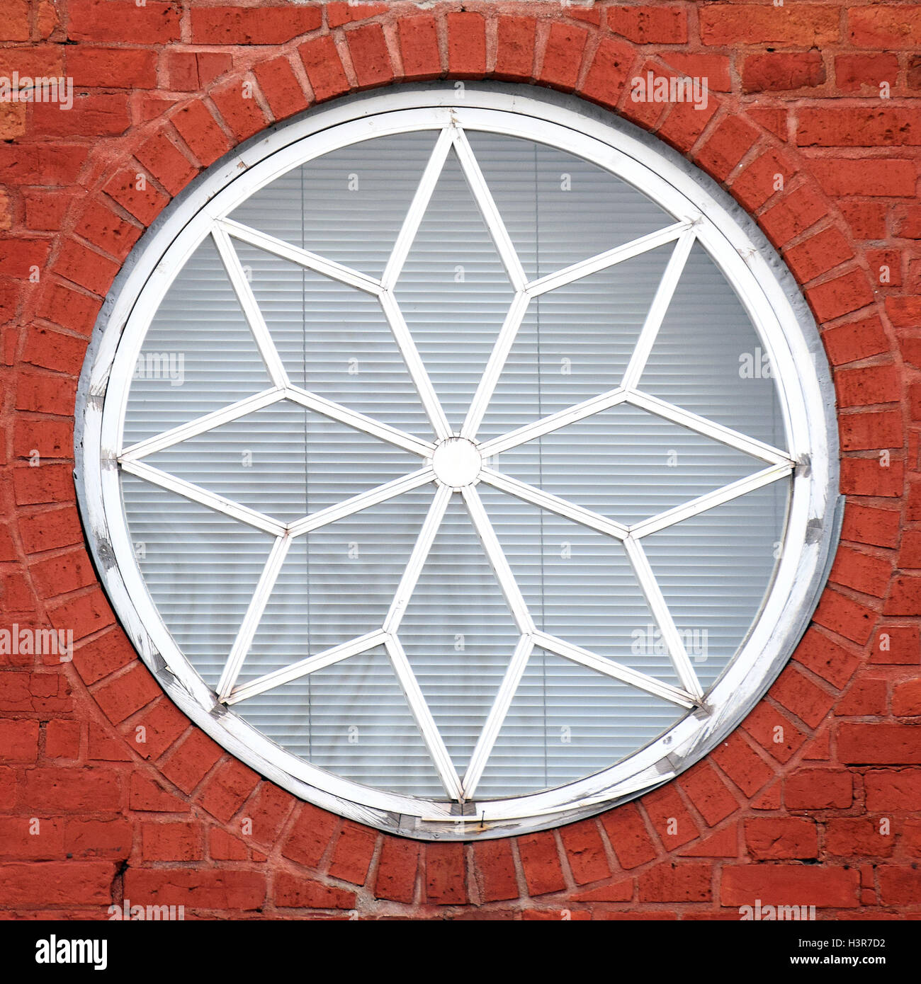 Old round window with brick wall background Stock Photo - Alamy