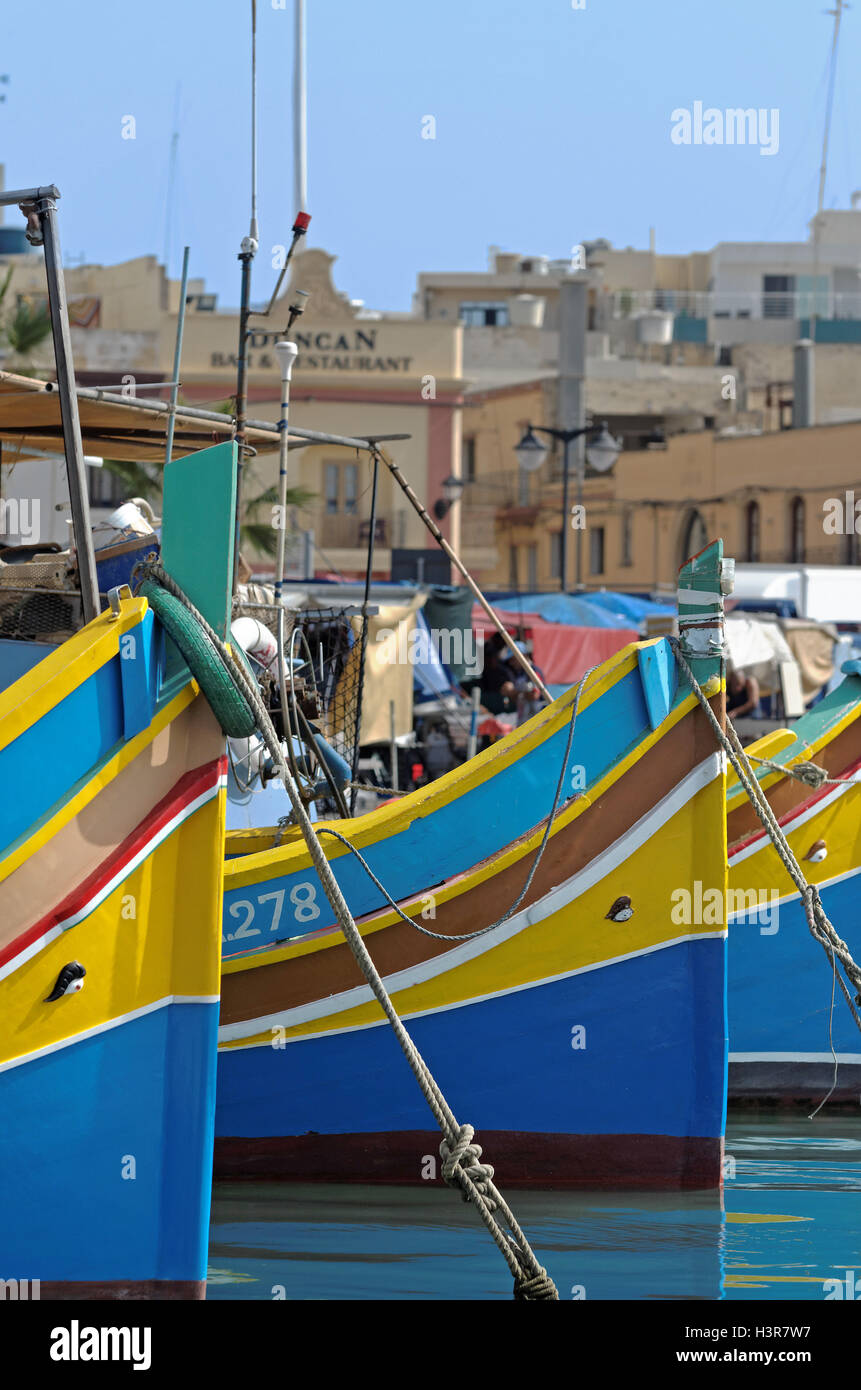 Traditional Maltese fishing boats in the largest fishing village of the ...