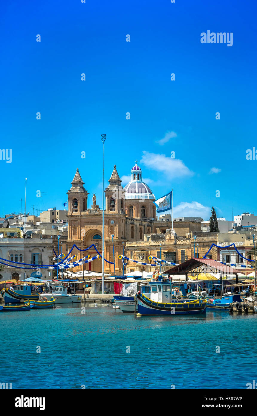 Traditional Maltese fishing boats in the largest fishing village of the ...