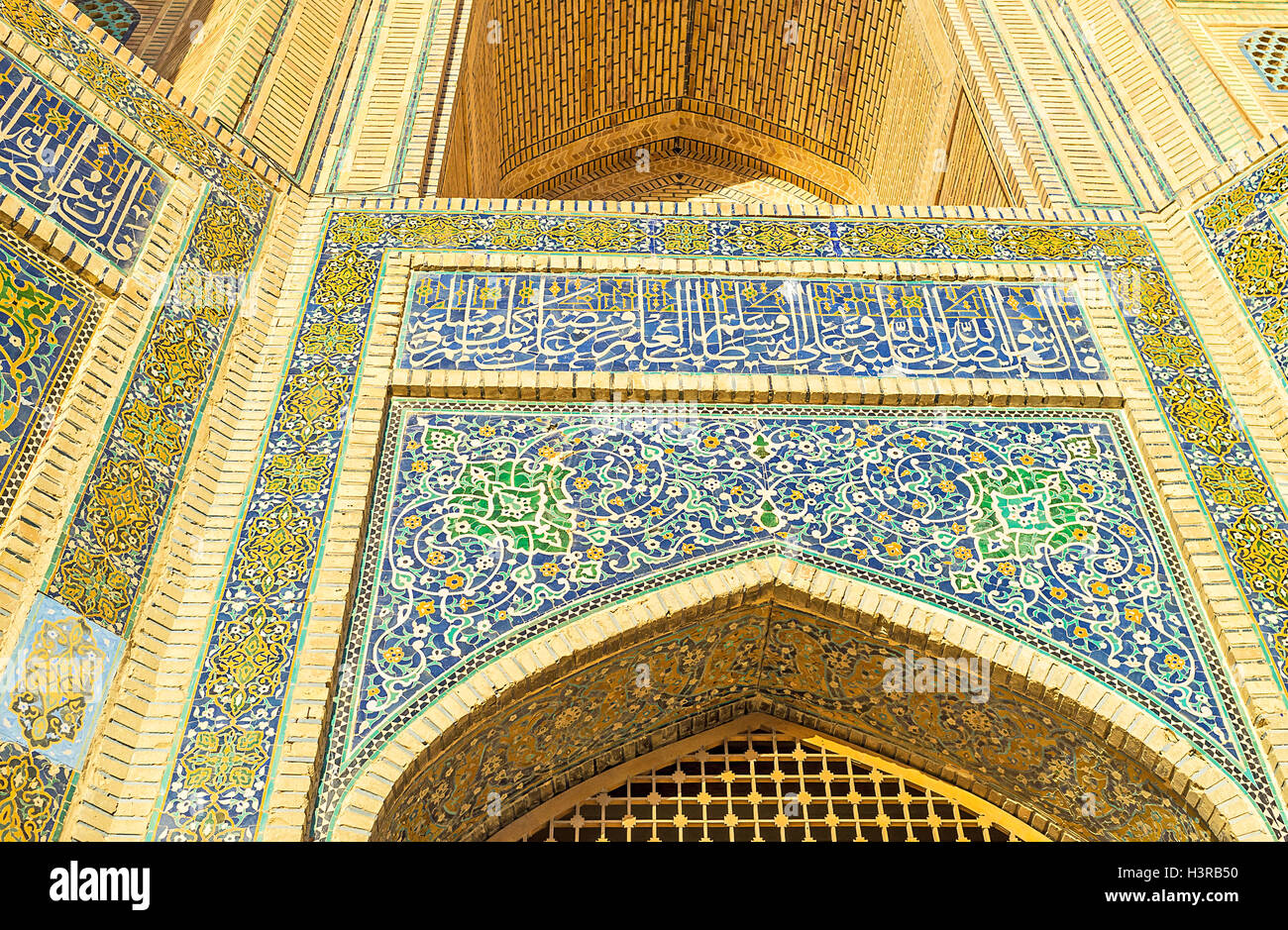 The central portal of the Mir-i Arab Madrassah decorated with colorful ...