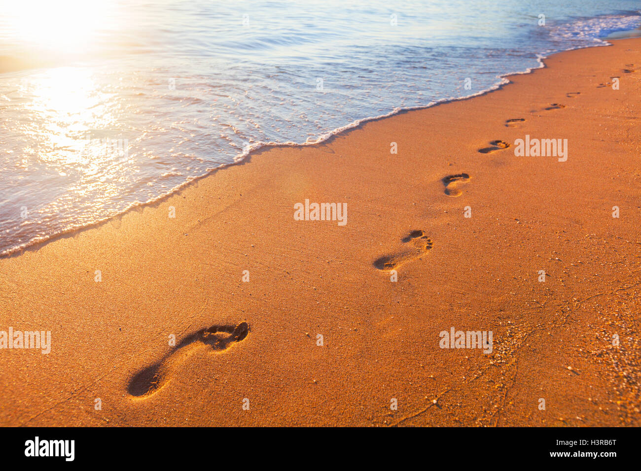 beach, wave and footprints Stock Photo - Alamy