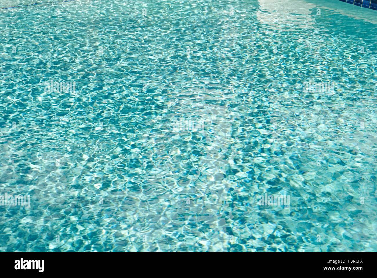Blue swimming pool rippled water detail Stock Photo - Alamy
