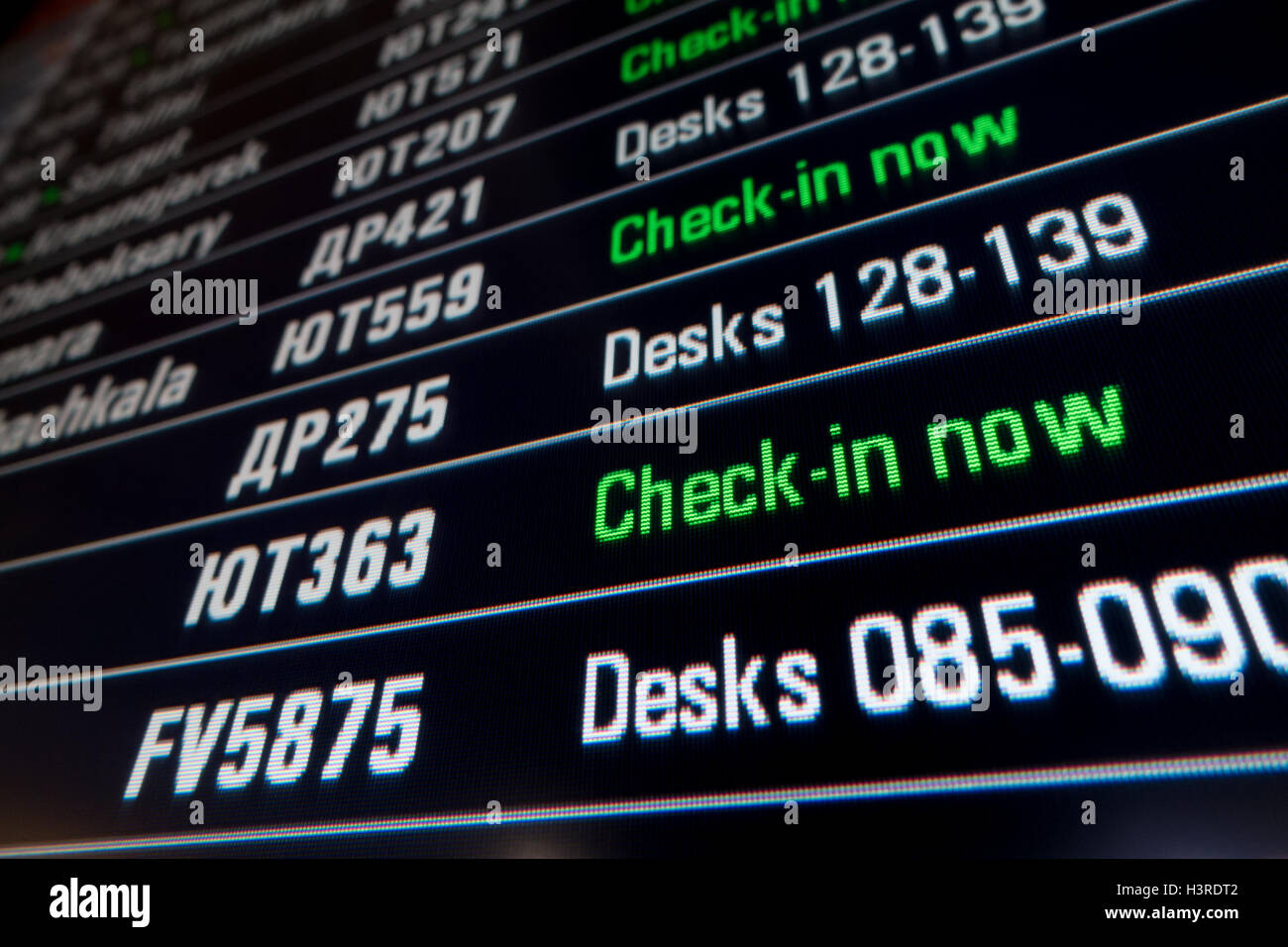 Timetable digital board at an airport Stock Photo - Alamy