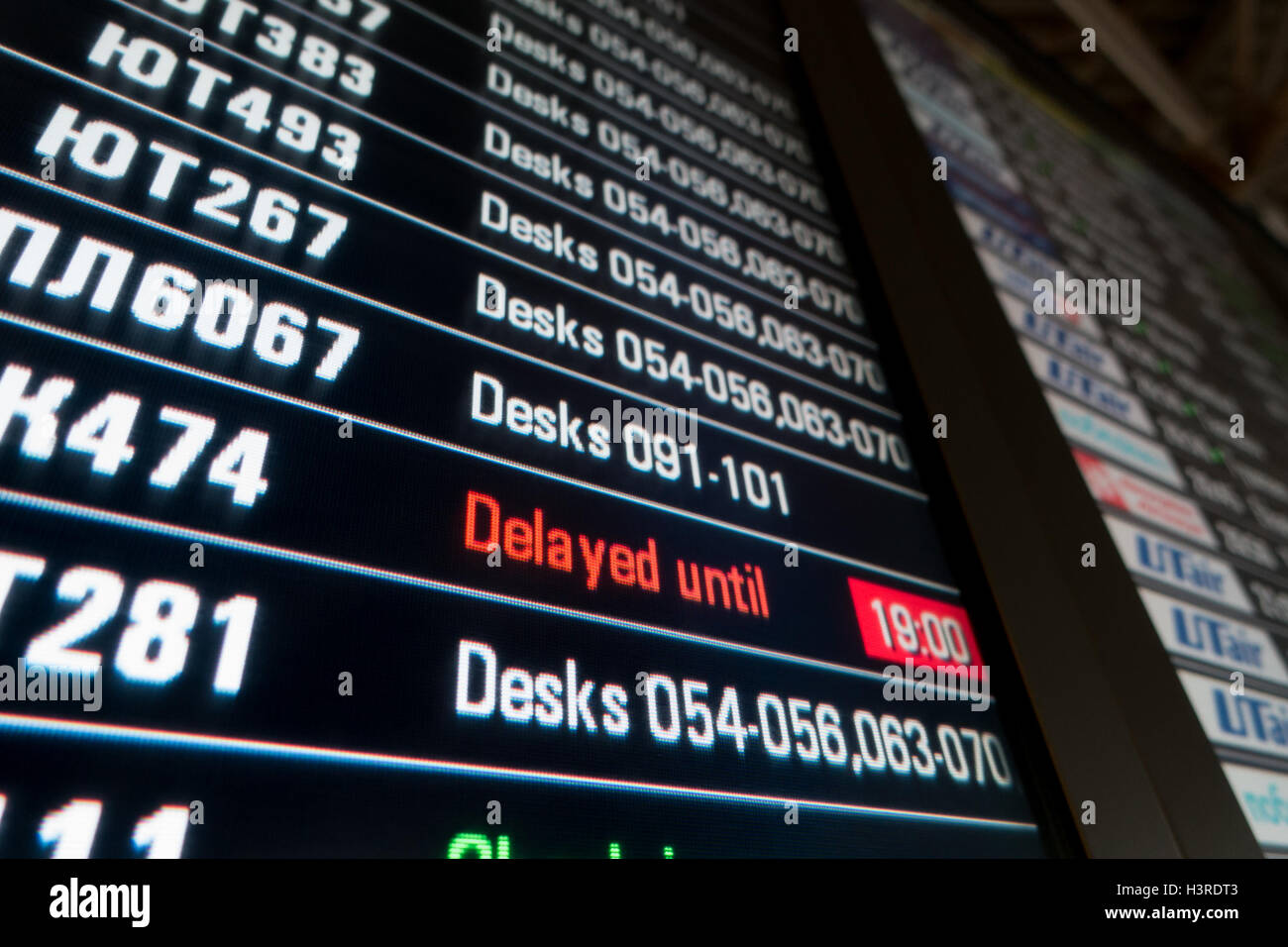 Timetable digital board at an airport Stock Photo - Alamy