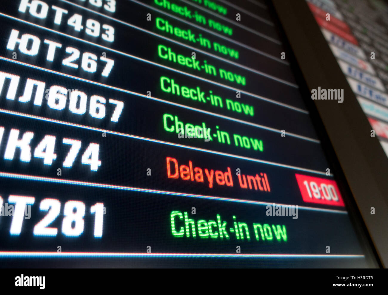Timetable digital board at an airport Stock Photo - Alamy