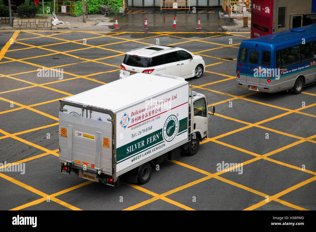 Traffic in yellow box junction in Central District of Hong Kong, China ...