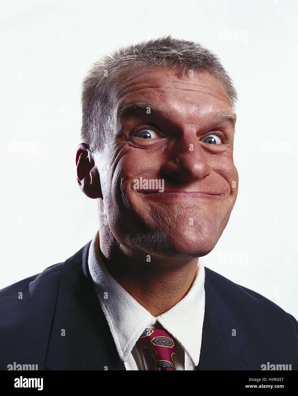 Man, suit, facial play, grimace, grin, portrait, studio, cut outs ...