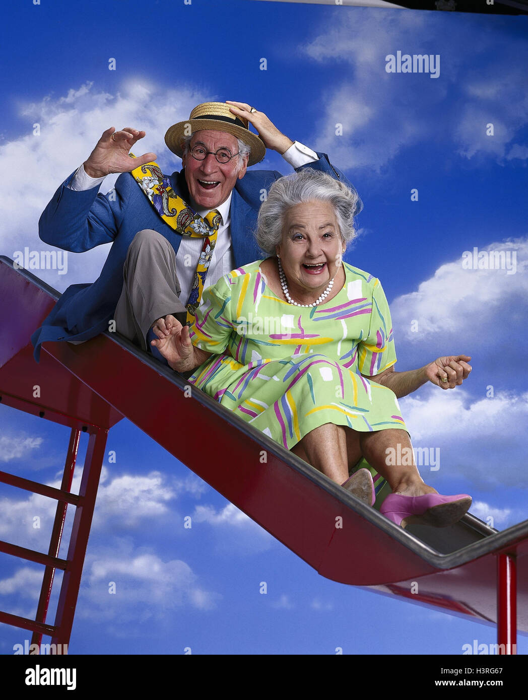 Senior couple on children's slide, cloudy sky, studio mb 130 A6, senior ...