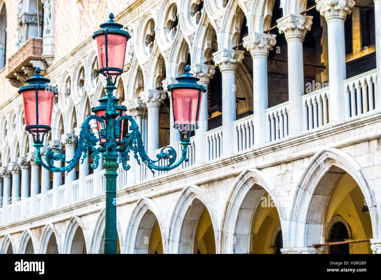 Lamp post with three unlit lights with Libreria Sansoviniana (Library ...