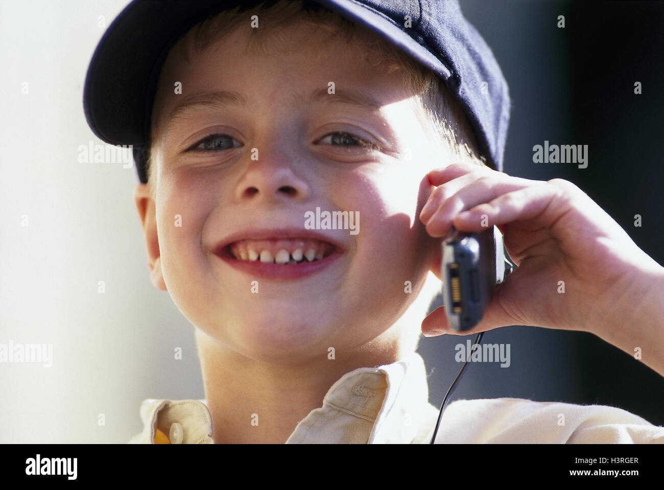 Boy, sign cap, mobile phone, call up, portrait, laugh, outside, child ...