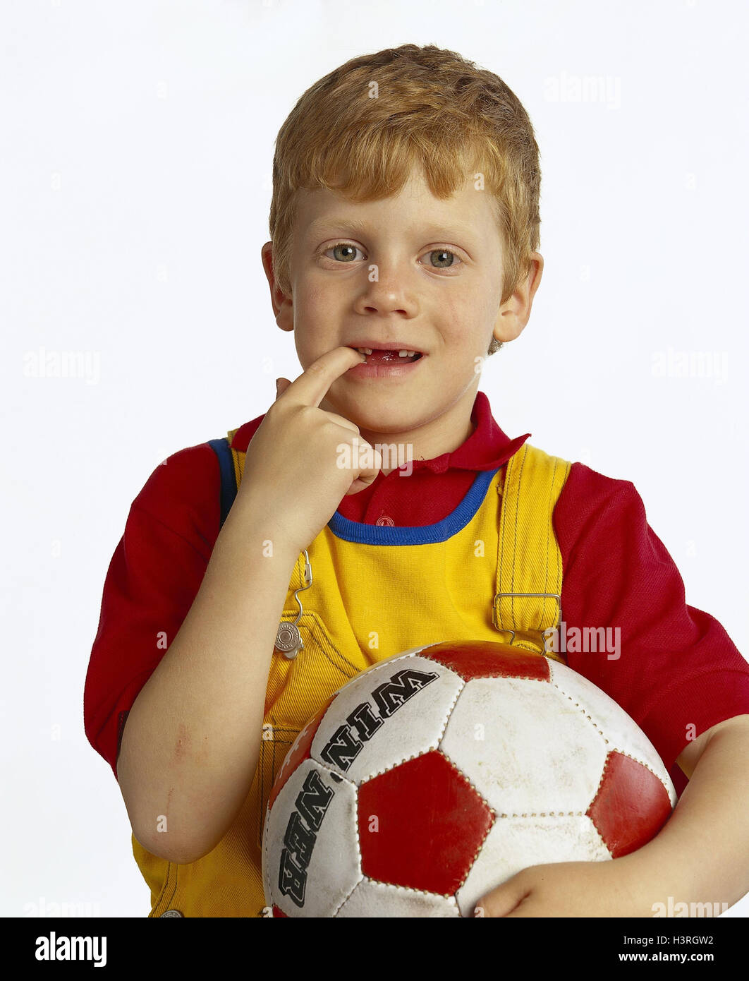 small boy, football, finger, mouth, portrait, mb 57 A6 Stock Photo - Alamy