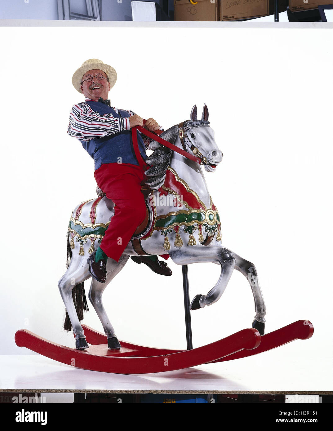 Senior, care, rocking horse, studio mb 131 A4 Stock Photo - Alamy