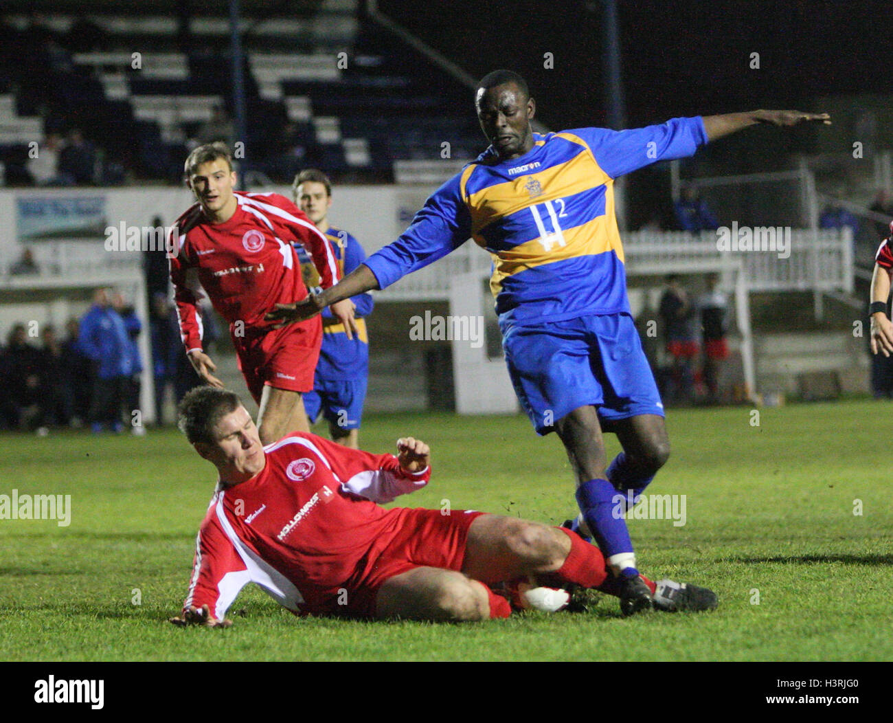 Manzi Mbala of Romford is challenged in the area by Craig Dennis of ...