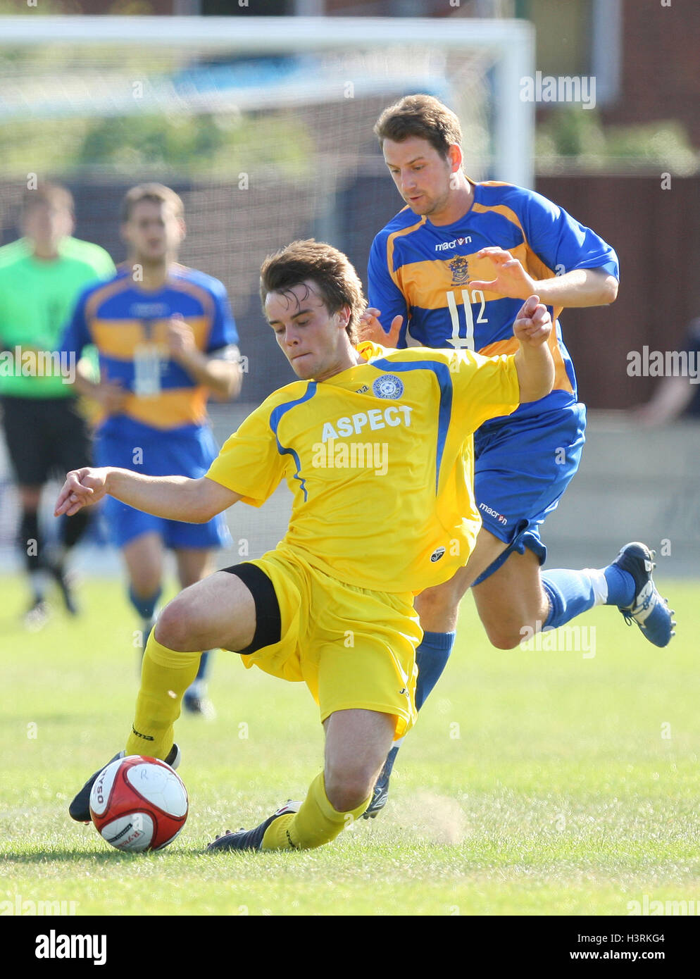 Jack Carlisle of Concord shields the ball from Bobby Port of Romford ...
